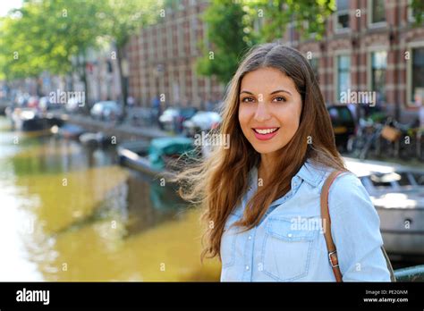 Smiling Urban Girl On Bridge Looking At Camera Young Beautiful Woman