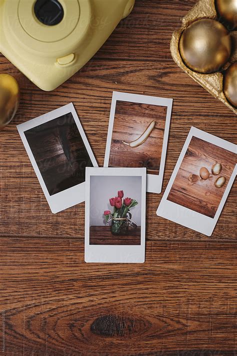 Polaroid Pictures On A Table By Stocksy Contributor Mosuno Stocksy