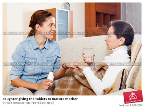Daughter Giving The Tablets To Mature Mother Стоковое фото № 7066268 фотограф Яков Филимонов