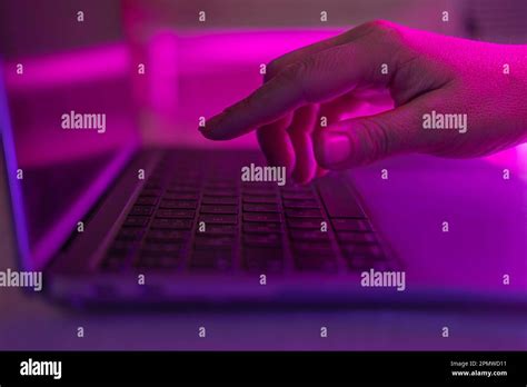 Person Typing At Laptop Computer At Night Female Uses Keyboard Shakes