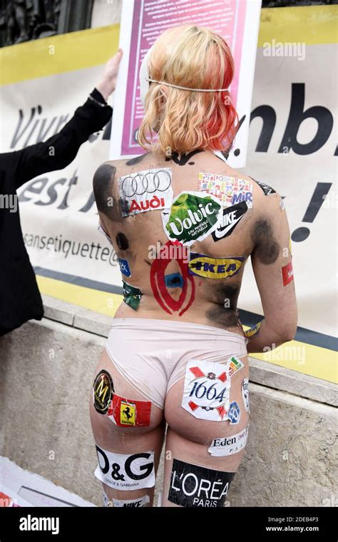 Contains Nudity An Activist Wearing Logos Of International Brands
