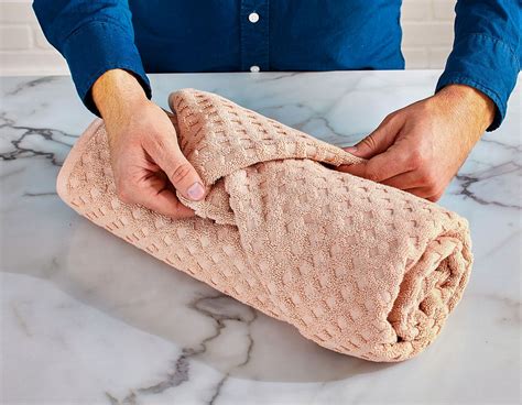 How To Fold Towels 4 Different Ways—to Be Stacked Hung Or Rolled
