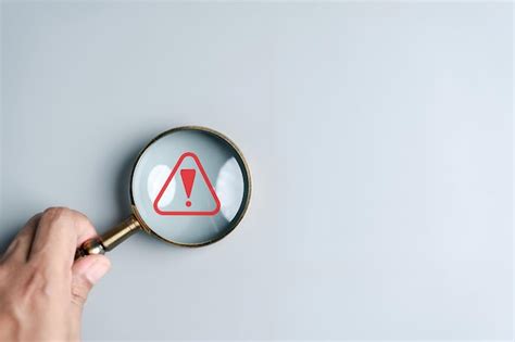 Premium Photo System Warning Caution Sign Inside Magnifier For Notification Error And