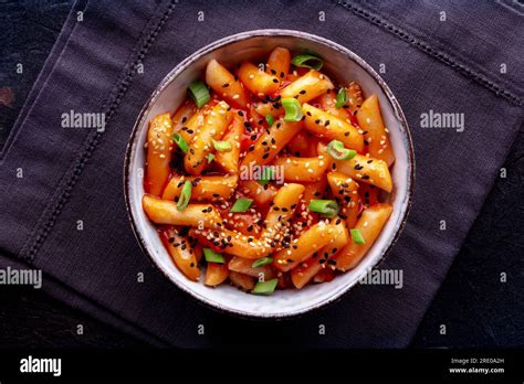 Tteokbokki Or Topokki Korean Street Food Spicy Rice Cakes In Red