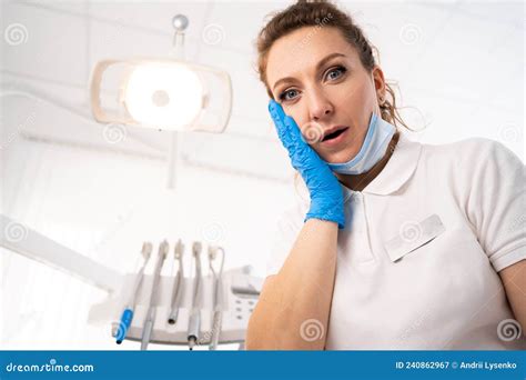 Shocked Young Female Doctor Looks At The Camera Frustrated Hung Bad