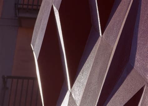 Gg Loop Transforms Italian House With Red Faceted Facade