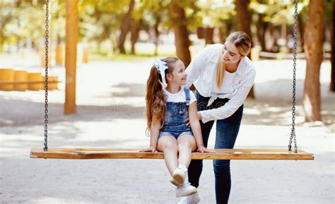 Mother Pushing Daughter Swings Spending Time Together Playground Stock