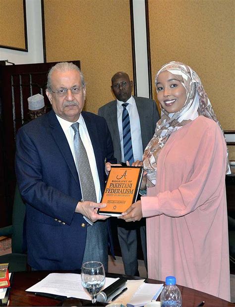 Senator Mian Raza Rabbani Presenting A Book To Ahmad Osman Aden Deputy