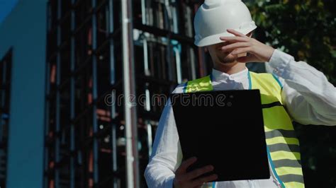 An Architect Uses A Construction Application On A Digital Tablet At A