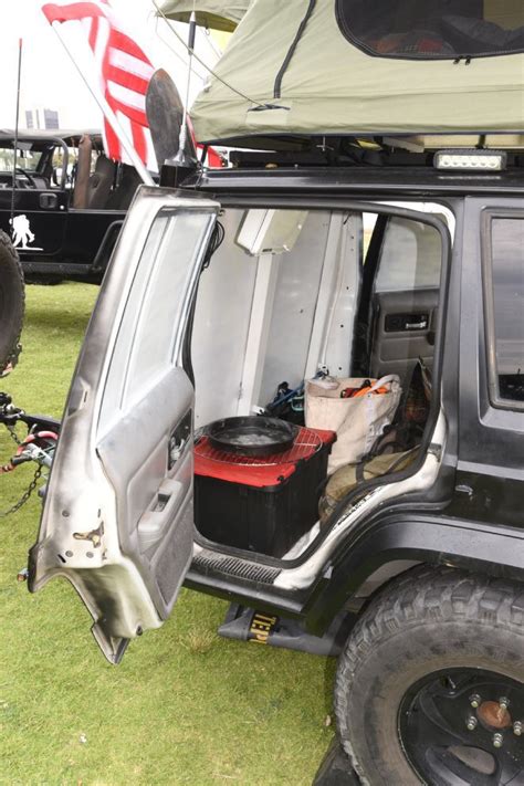 Jeep Xj With Open Doors And Roof Jeep Xj Camping Mods Jeep Cherokee Camping Setup Camping In
