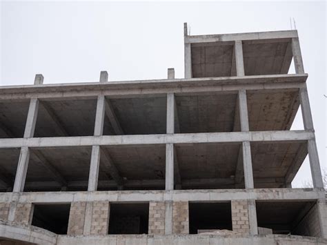 Premium Photo Unfinished House Made Of Reinforced Concrete Multi Storey