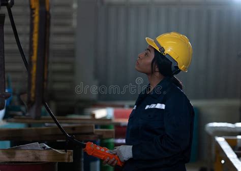 Female Technicians Inspecting And Testing The Operation Of Lifting