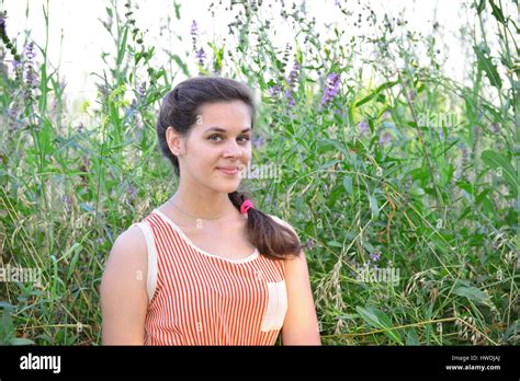 Portrait Of A Beautiful Russian Girl On A Background Of Blue