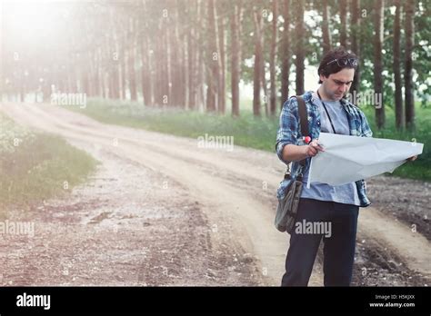 Man With Map Stand On A Road Stock Photo Alamy