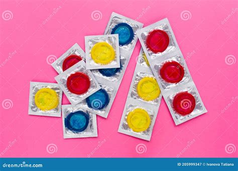 Composition With Colorful Condoms On Bright Pink Background Safe Sex