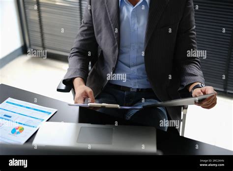 Experience Businesswoman Analyzing Graphs And Charts Preparing Economic Report At Office Desk