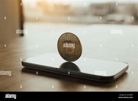 Bitcoin Symbol On Smartphone Screen And Cryptography Concept Stock Photo Alamy