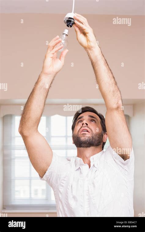 Man Replacing The Light Bulb Stock Photo Alamy