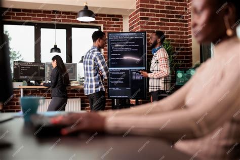 Free Photo Two Of Company Programming Engineers Analyzing Html Code