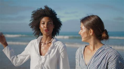 Premium Photo Two Girls Talking Sea Shore Closeup Carefree Lesbian