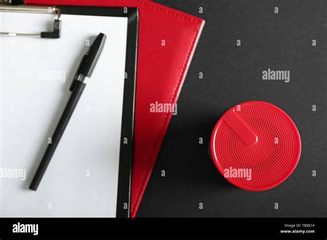 Smart Home Assistant Device With Stationery On Dark Background Stock