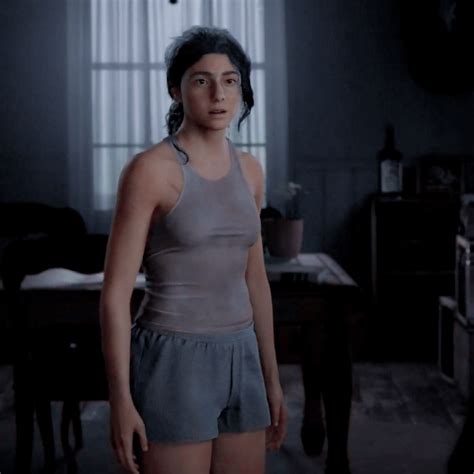 A Woman Standing In Front Of A Window