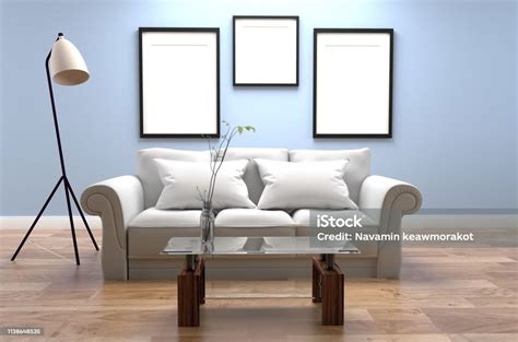 현대 거실 인테리어블루 스타일과 나무 바닥 및 밝은 파란색 벽 배경에 프레임소파와 유리 테이블에 베개 램프 꽃병을 갖춘 객실입니다 3d 렌더링 0명에 대한 스톡 사진 및