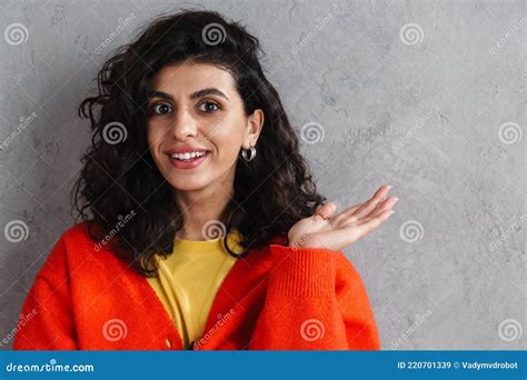 Happy Beautiful Brunette Girl Smiling And Showing Copyspace Stock Image