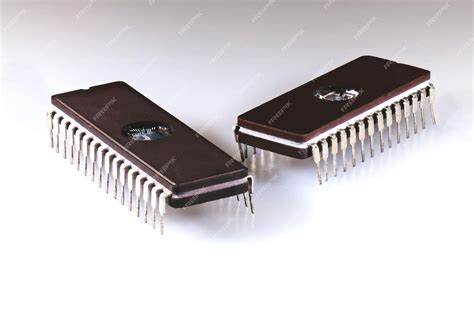 Premium Photo Closeup Shot Of Two Eeprom Memory Chip On A White Background