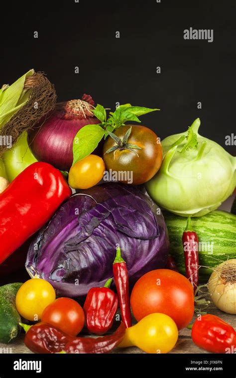 Different Types Of Fresh Vegetables On A Wooden Table Harvesting