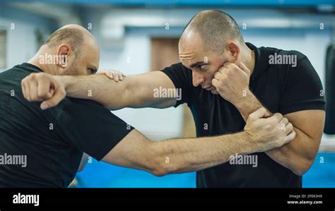 Sparring Training And Demonstration Of Street Fight Technique Against Attacker In Dojo Gym