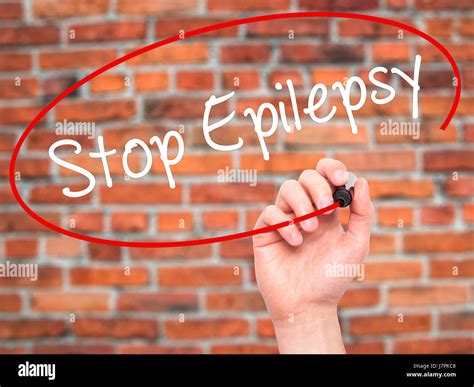 Man Hand Writing Stop Epilepsy With Black Marker On Visual Screen Isolated On Background
