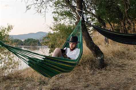 Chilling In A Hammock By Stocksy Contributor Mihajlo Ckovric Stocksy