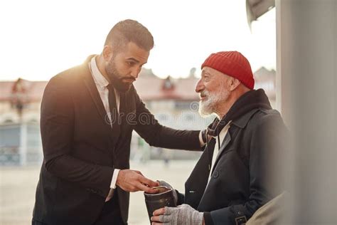 Poor Man And Rich Man Help Contrast Between People Stock Image
