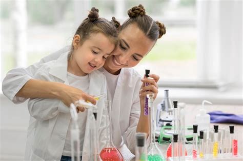 Free Photo Woman With Girl In Lab Doing Experiments