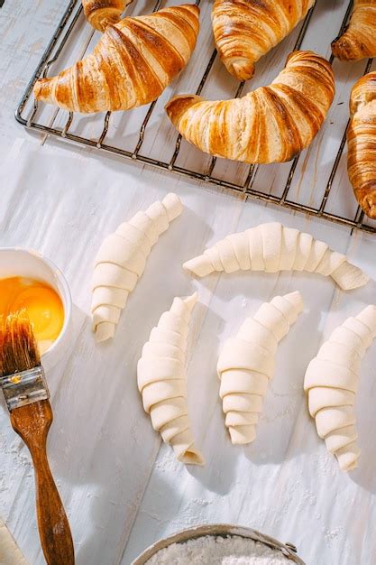 Premium Photo The Chef Cooks Croissants In The Kitchen In The Morning