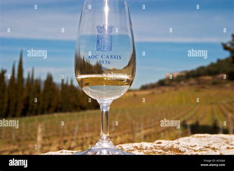 Glass Marked With Aoc Cassis 1936 In Front Of The Vineyard Château