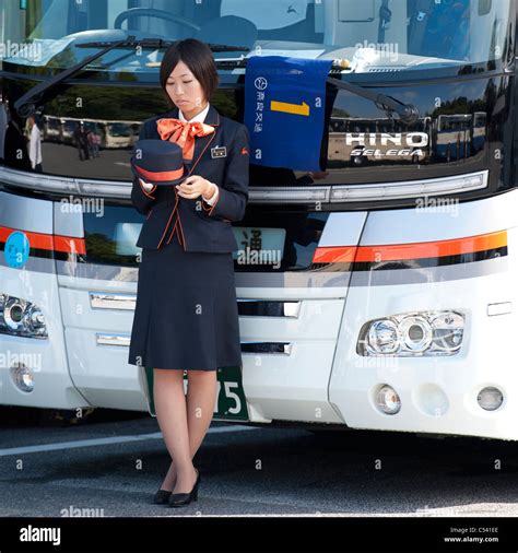 female tour guide standing in front of a bus at todaiji temple nara