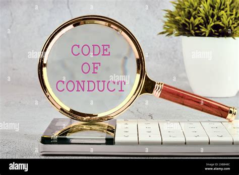 Code Of Conduct Words Written Through A Magnifying Glass Standing On A