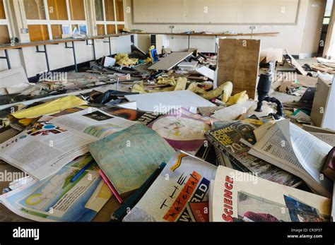 Books And Papers Are Strewn Over The Floor In The Classroom Of An Stock