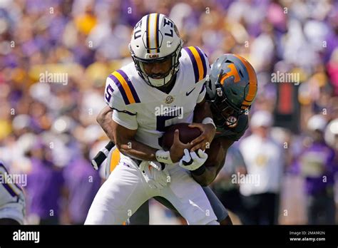 Lsu Quarterback Jayden Daniels 5 Is Sacked By Tennessee Defensive