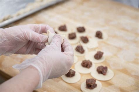 A Woman Makes Dumplings With Meat By Hand In Production Factory For The Production Of Food