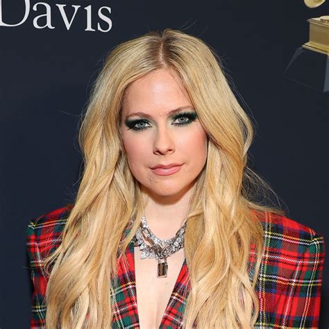 Avril Lavigne Poses In Thigh High Boots And Bralette As She Shares New Heartbreak Hello