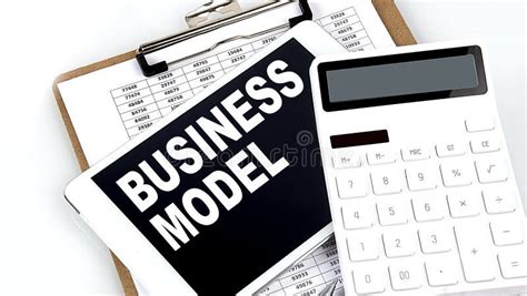 Business Model Text On A Tablet With Chart Calculator And Pen Stock Image Image Of