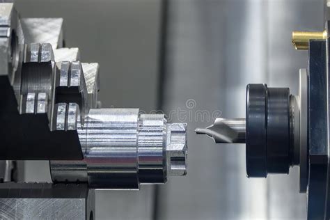 The Metal Shaft Chamfering Process On Cnc Lathe Machine In The Light Blue Scene Stock Image
