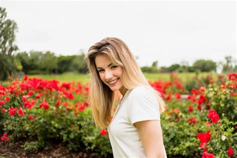 Pretty Woman Standing In Flower Garden Free Photo