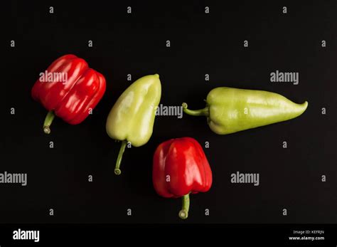 Fresh Red Bell Pepper And Green Close Up On A Black Background Stock