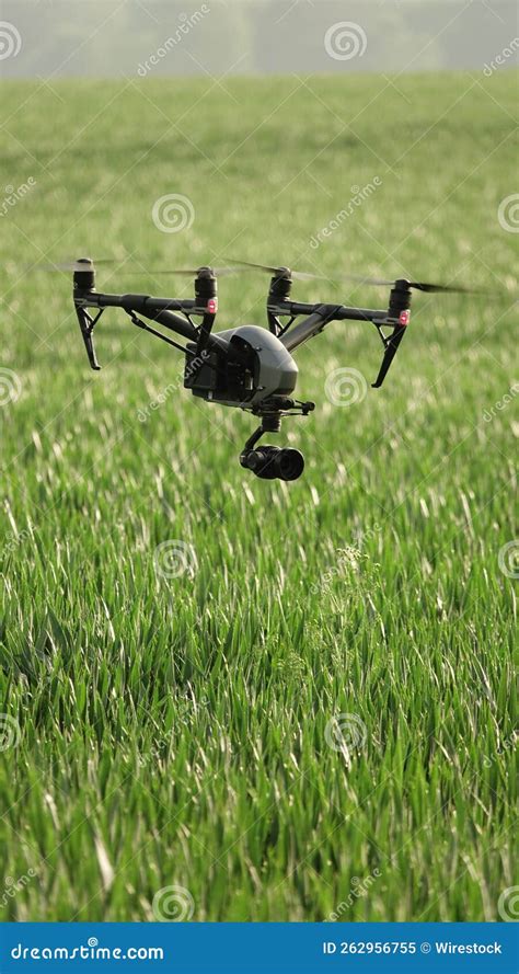 Vertical Shot Of Drone For Insecticide Injection Flying Over Agriculture Field During Summer