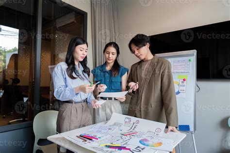 Ux Developer And Ui Designer Presenting Mobile App Interface Design On Whiteboard In Meeting At