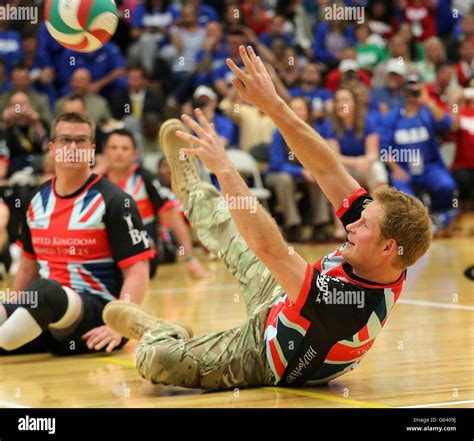 Prince Harry Plays For The Uk Team Against The Usa During A Seated Volleyball Exhibition Match